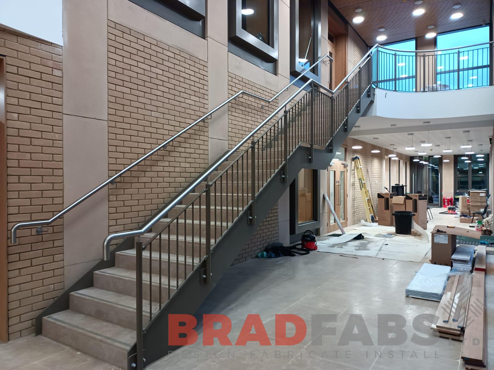 Internal staircase with glass balustrade and oak treads by Bradfabs